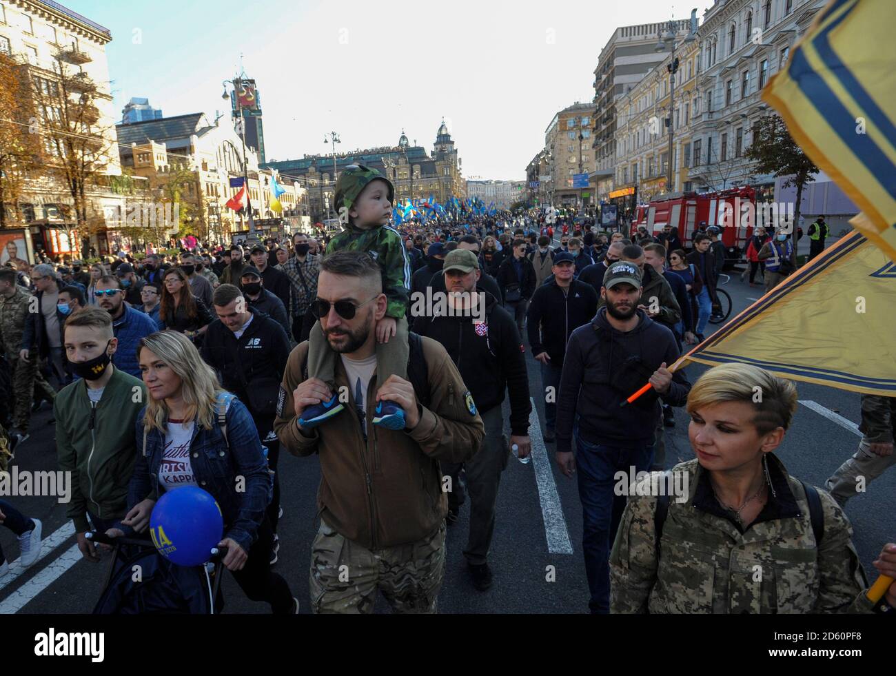 Kiev, Ukraine. 14th Oct, 2020. Father and kid marching during the rally ...