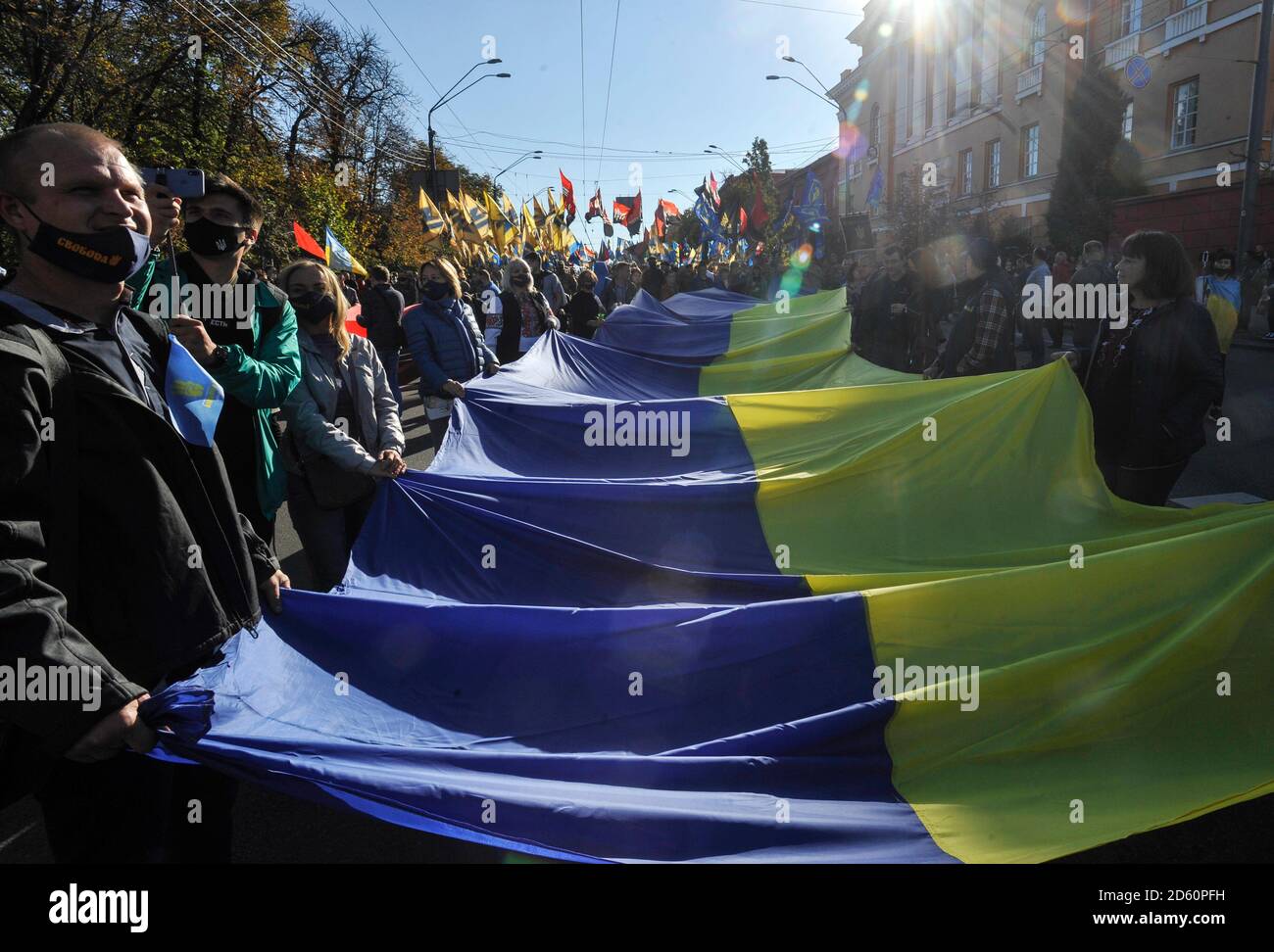 Kiev, Ukraine. 14th Oct, 2020. Activists marching with a huge Ukrainian ...