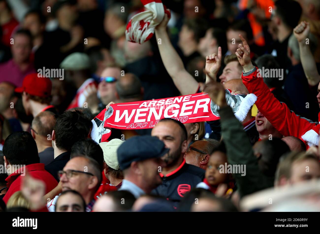Arsenal fans show their support in the stands Stock Photo - Alamy