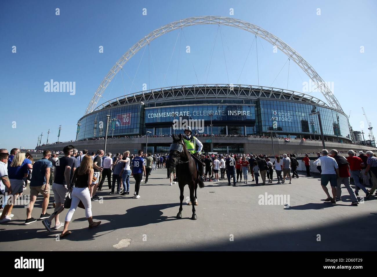 Police watch over supporters outside the ground before the game Stock ...