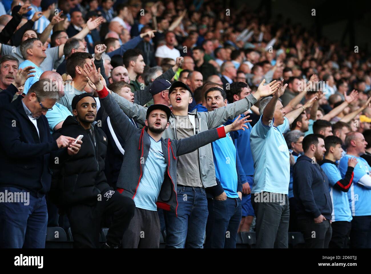Coventry City fans show their support in the stands Stock Photo - Alamy