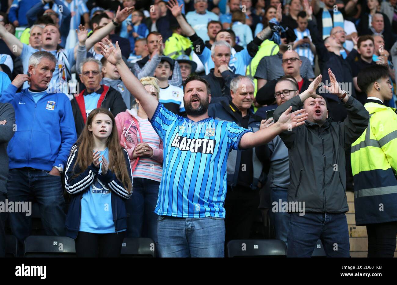 Coventry City fans show their support in the stands Stock Photo - Alamy
