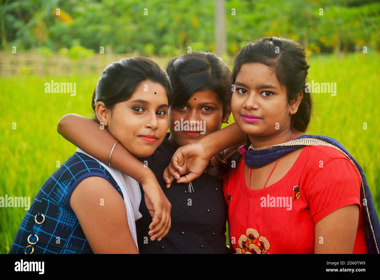 Close up of three teenage girls wearing colorful traditional Indian ...