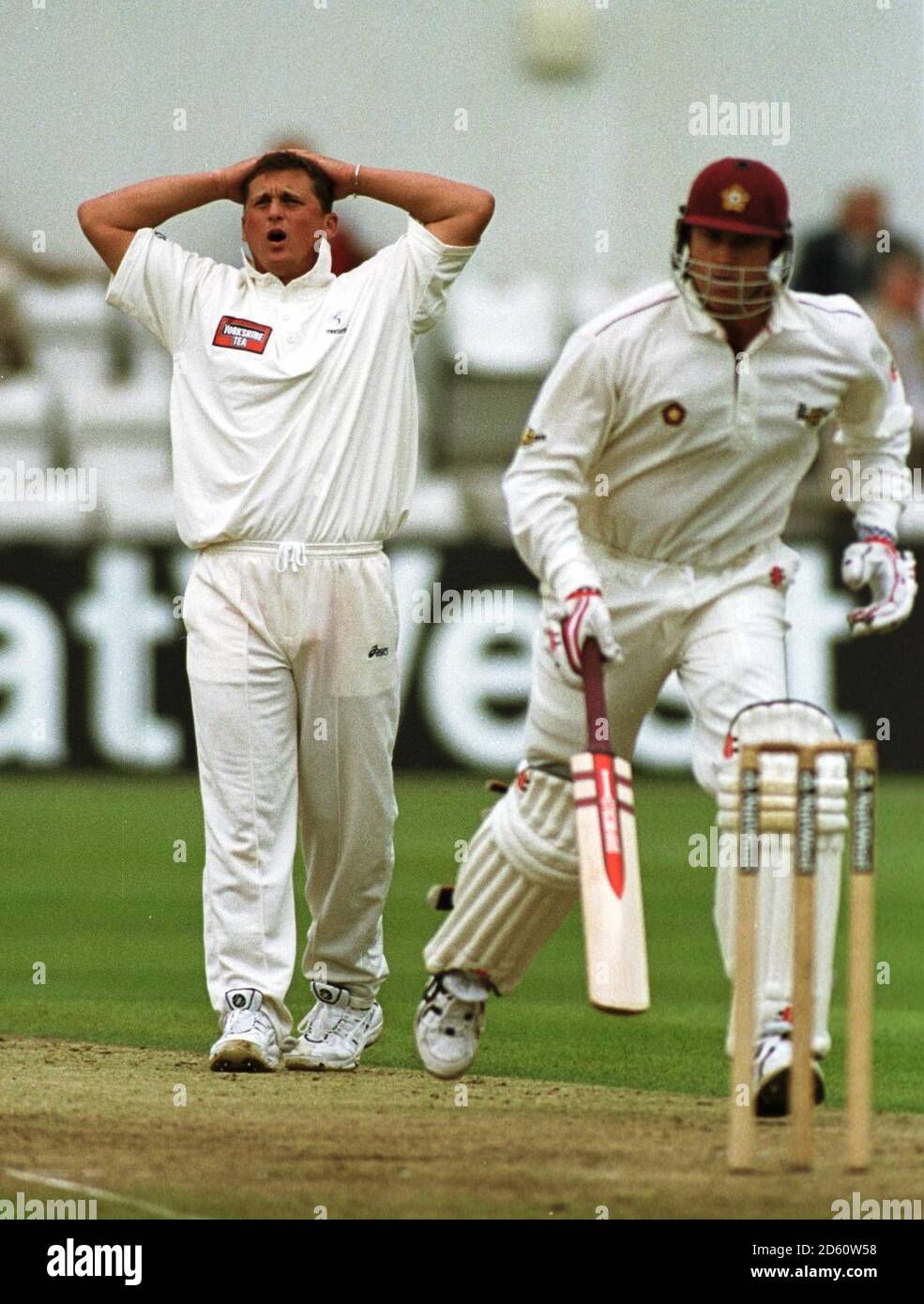 Yorkshire's Darren Gough (l) watches in despair as Northamptonshire's ...