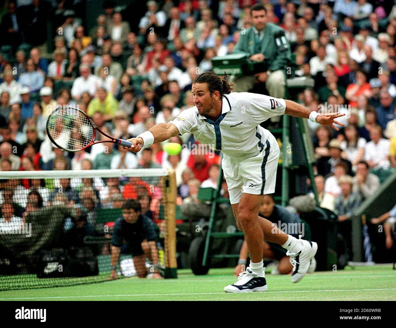 Pat Rafter lunges for and misses the ball Stock Photo - Alamy