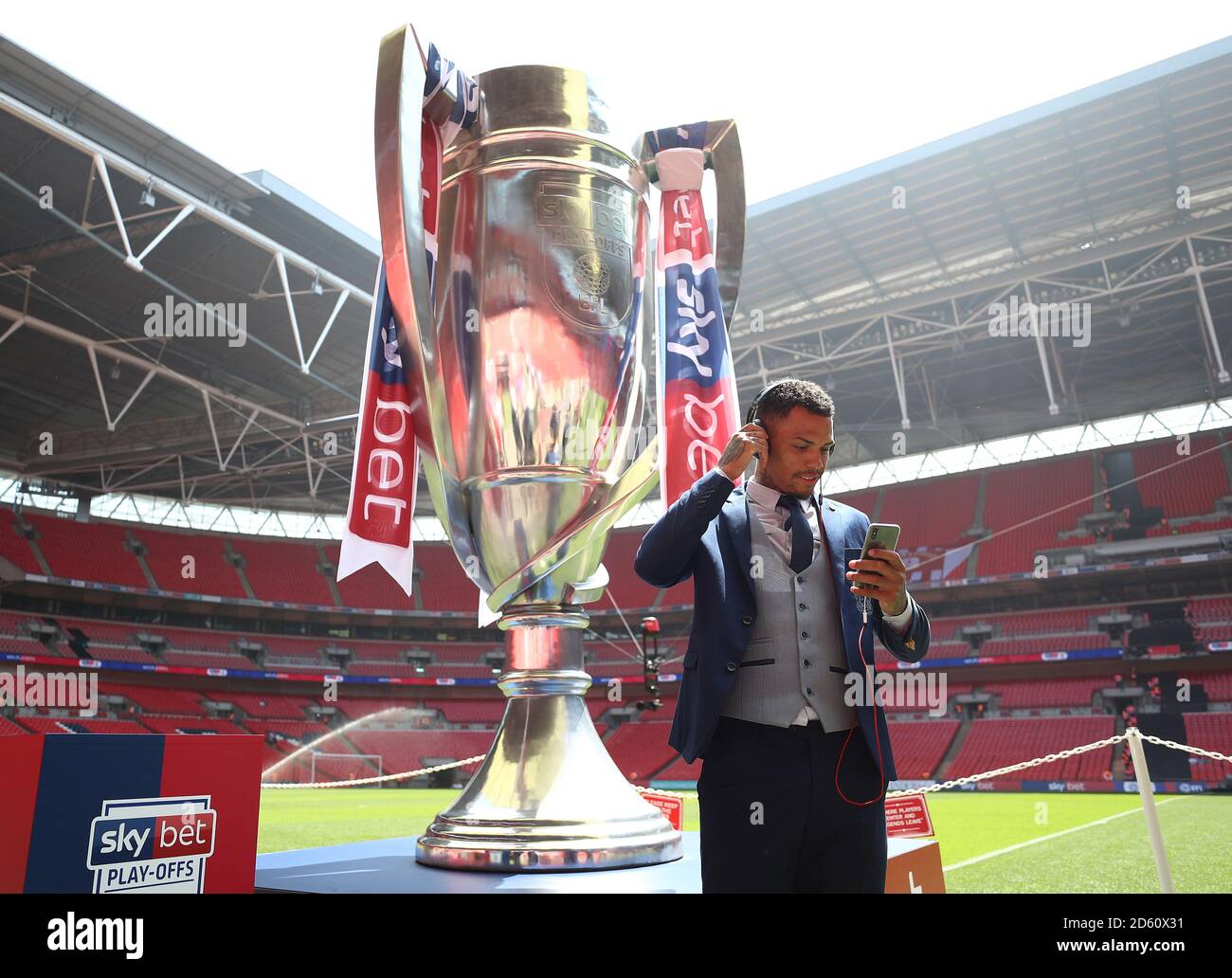 Coventry City's Jonson Clarke-Harris takes a photo next to a giant ...