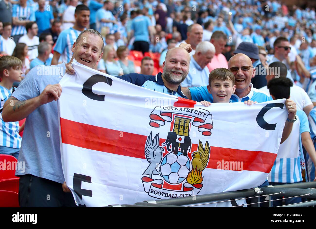 Coventry City fans hold a flag in the stands Stock Photo - Alamy
