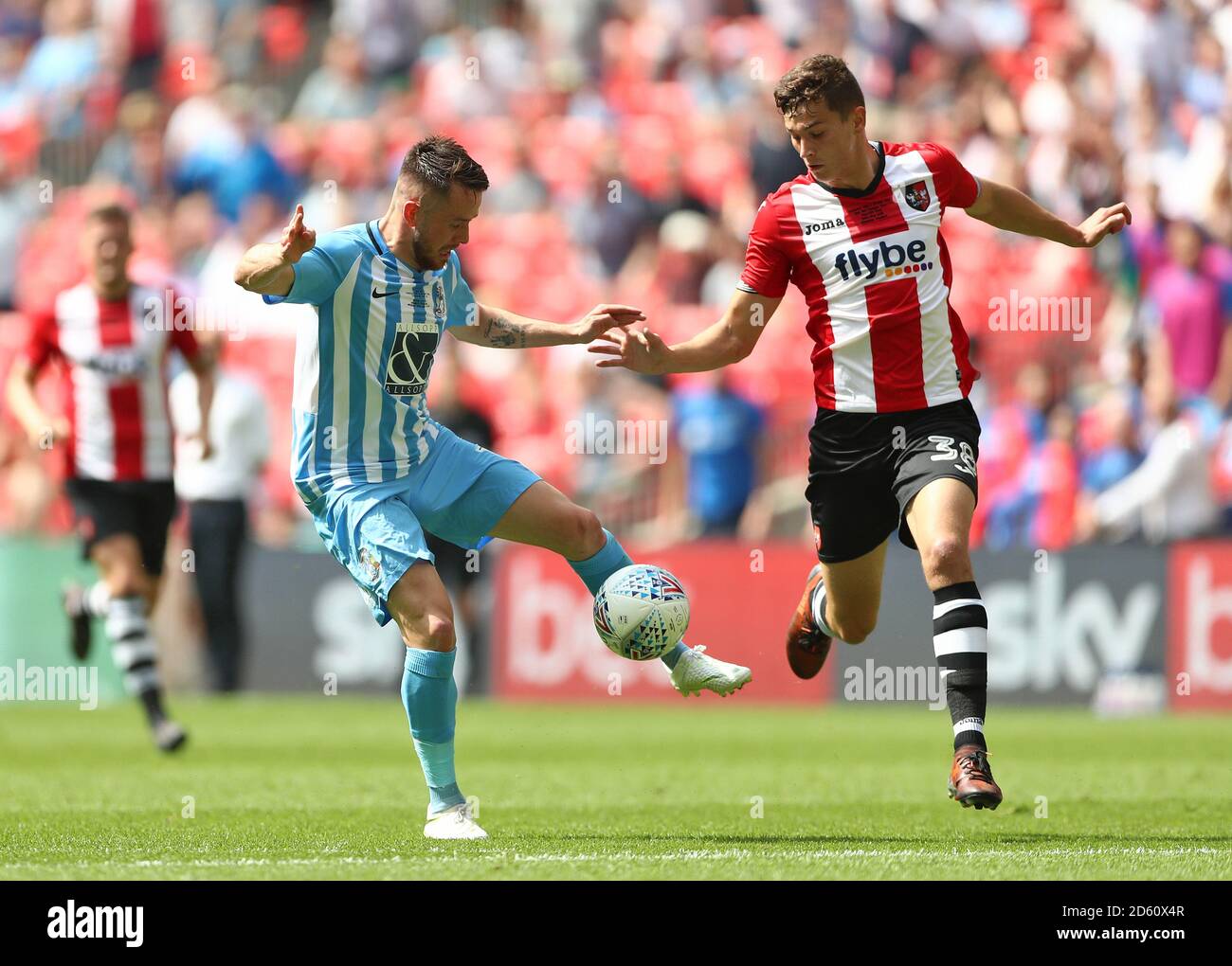 Coventry City's Marc McNulty (left) in action with Exeter City's Jordan ...