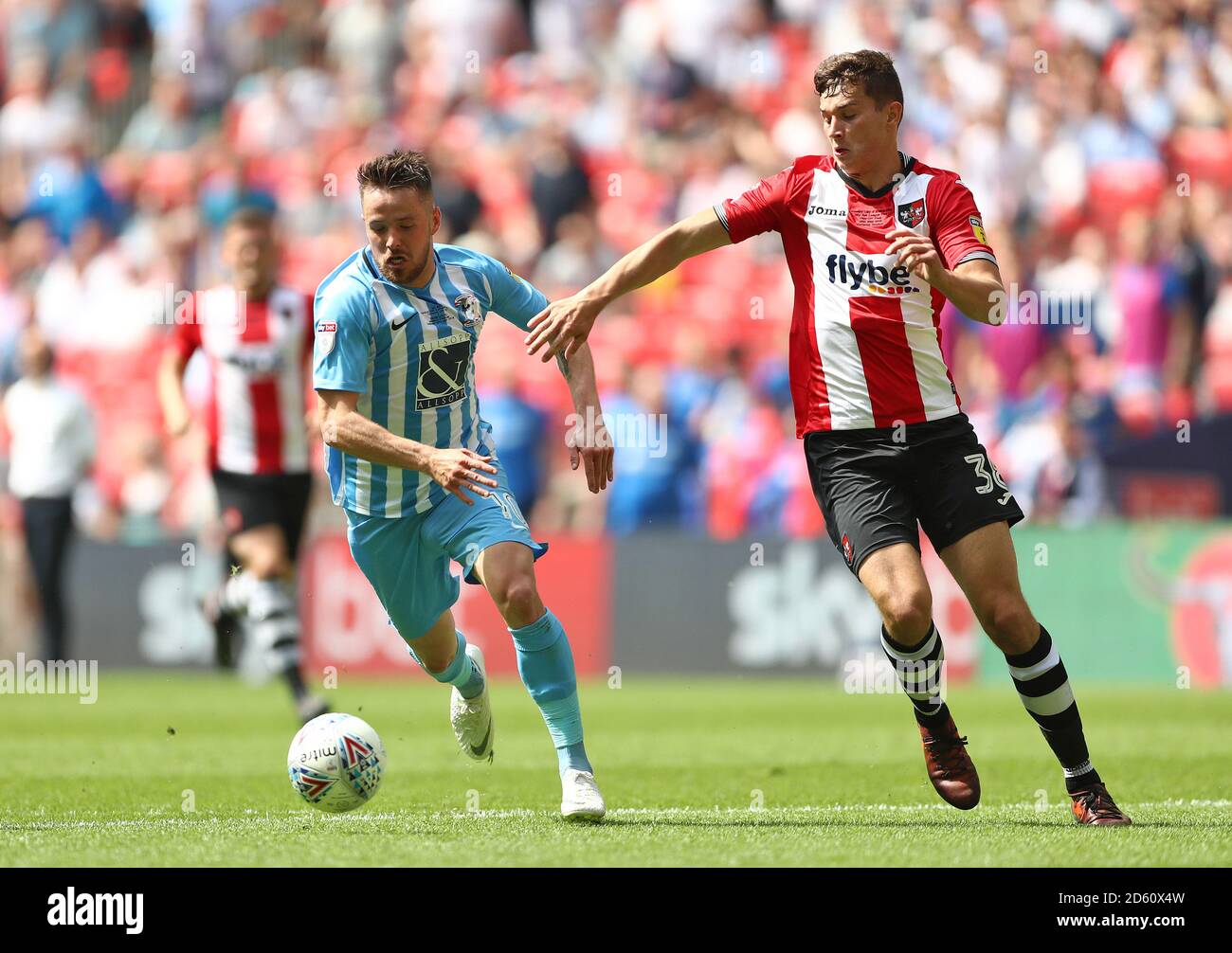 Coventry City's Marc McNulty (left) in action with Exeter City's Jordan ...