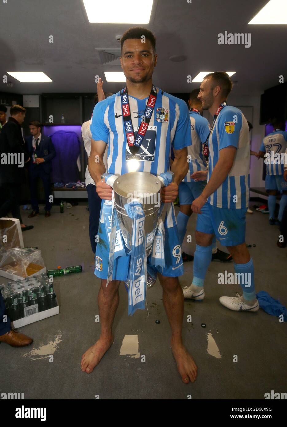 Coventry City's Maxime Biamou celebrates in the dressing room after the ...