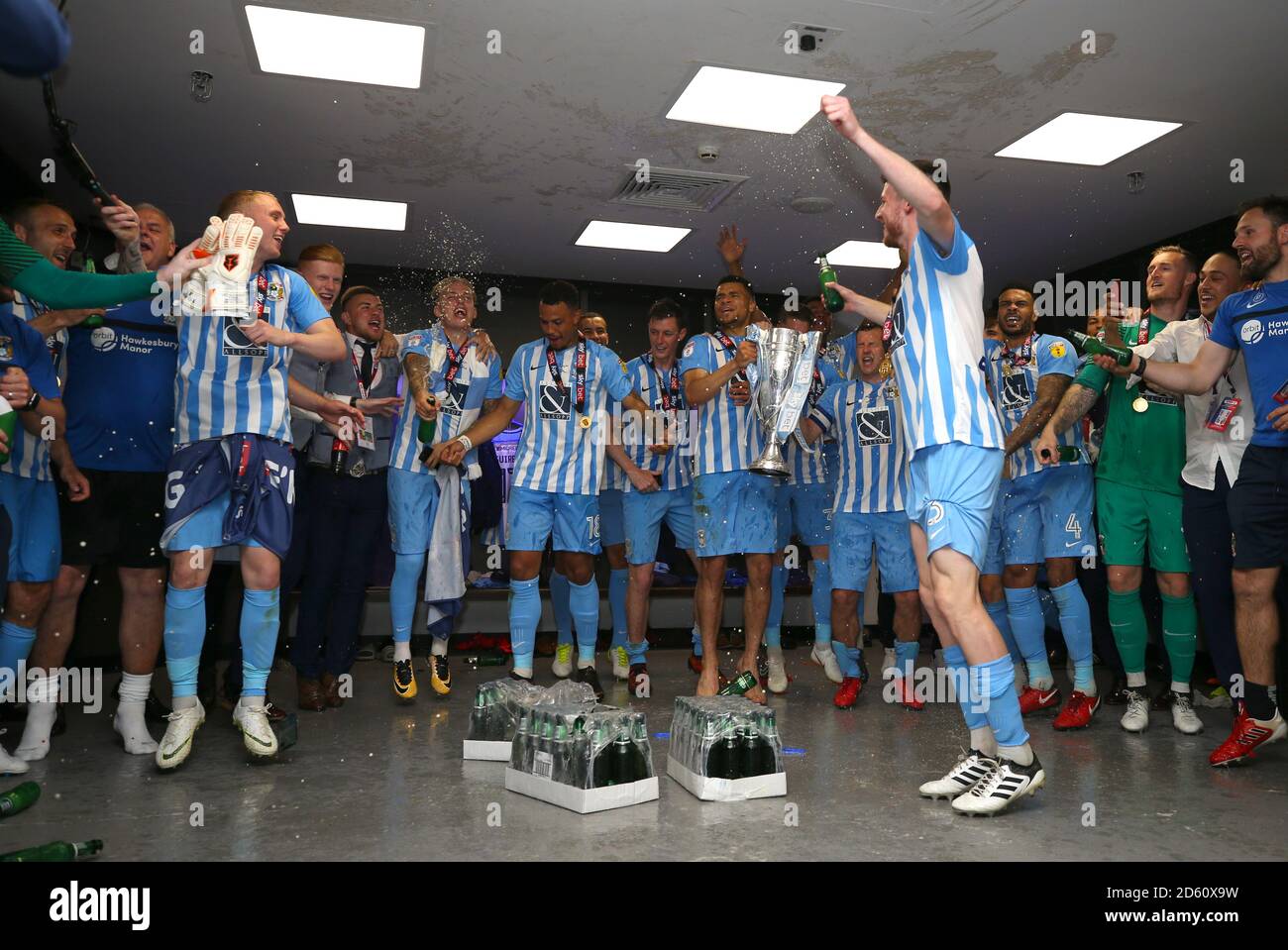Coventry City players celebrate with the trophy with his team-mates ...