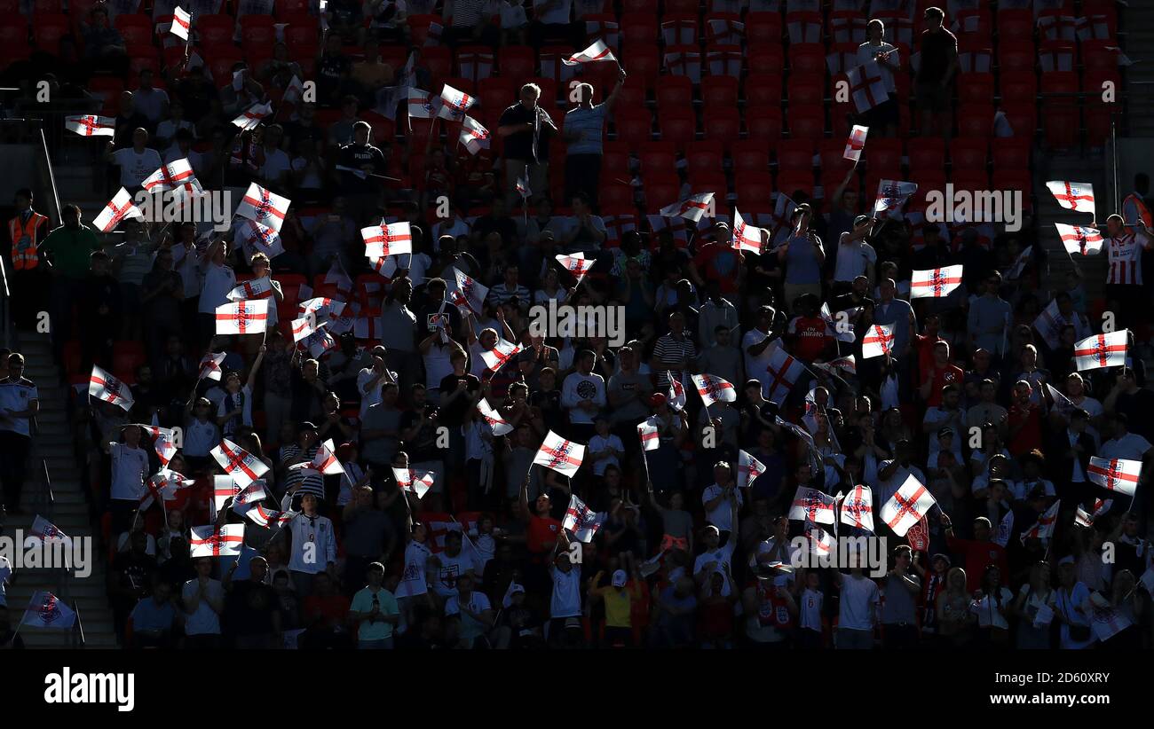 England fans wave flags during the game Stock Photo - Alamy