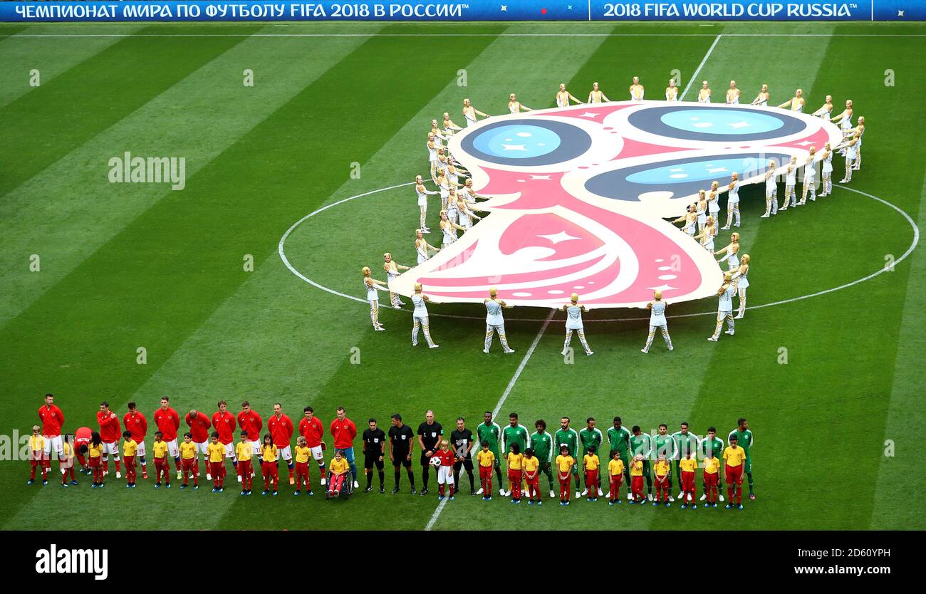 The two team's line-up before kick-off in front of a giant FIFA World ...