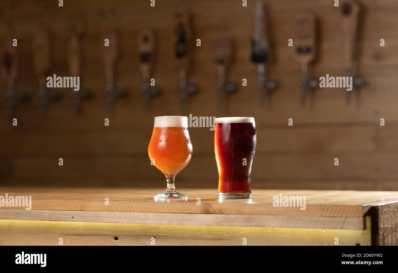 Fresh draft beer dispensers behind Stock Photo - Alamy