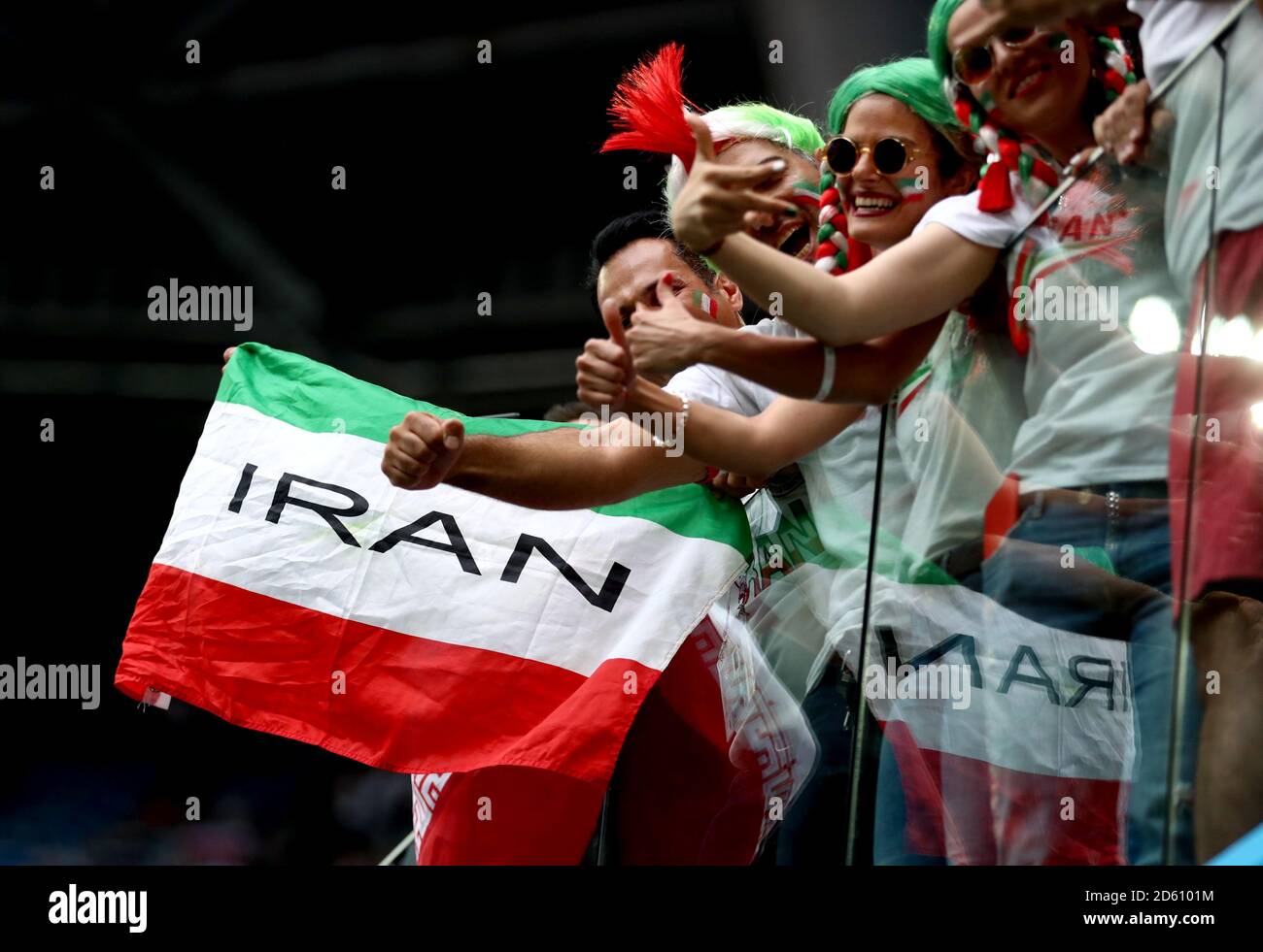 Iran fans in the stands wave banners to show their support Stock Photo ...