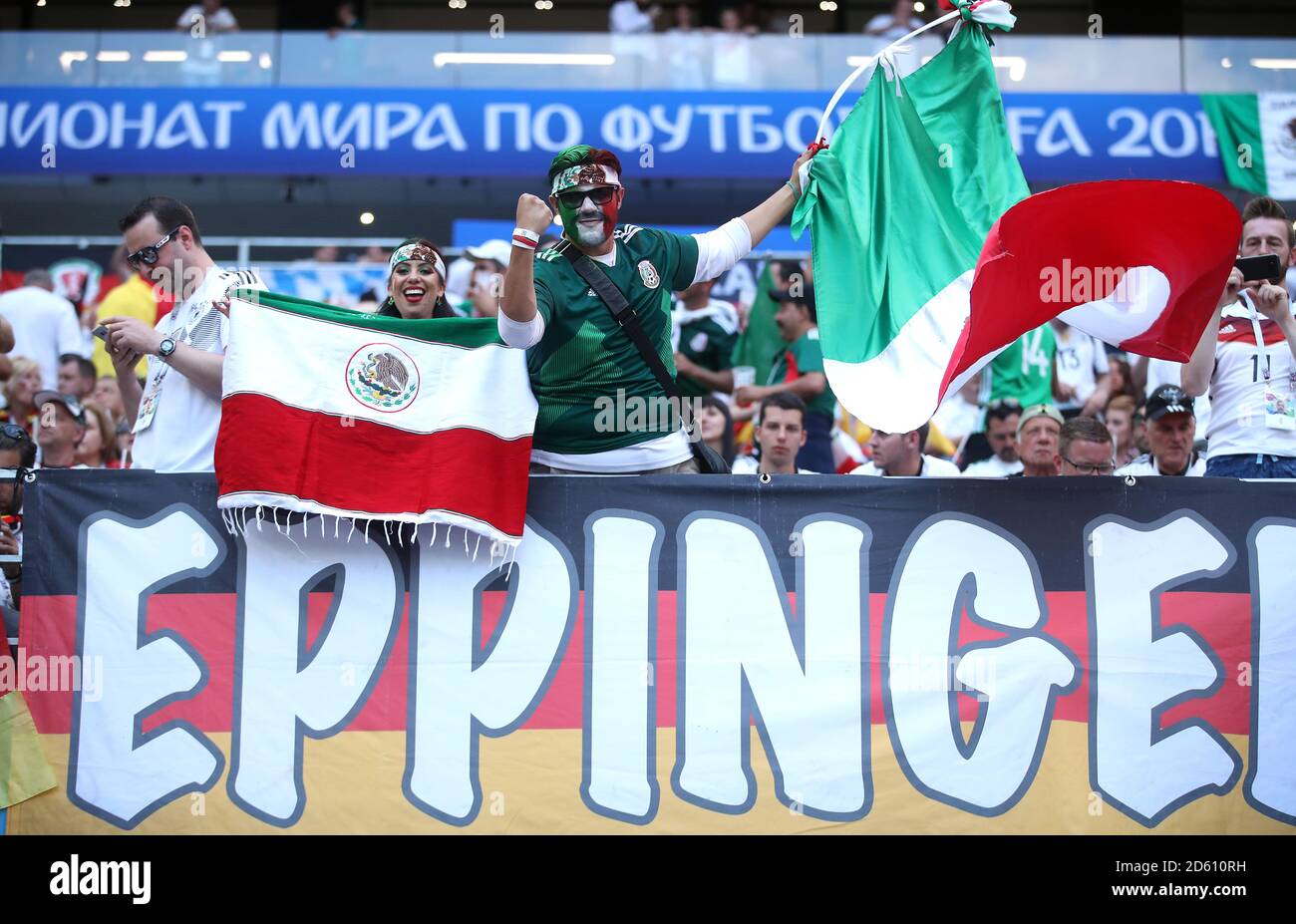 Mexico fans hold up flags before the game Stock Photo - Alamy