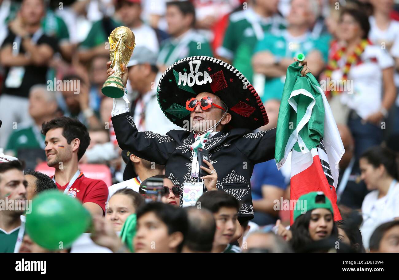 Mexico fan holding a replica world cup trophy during the game Stock ...