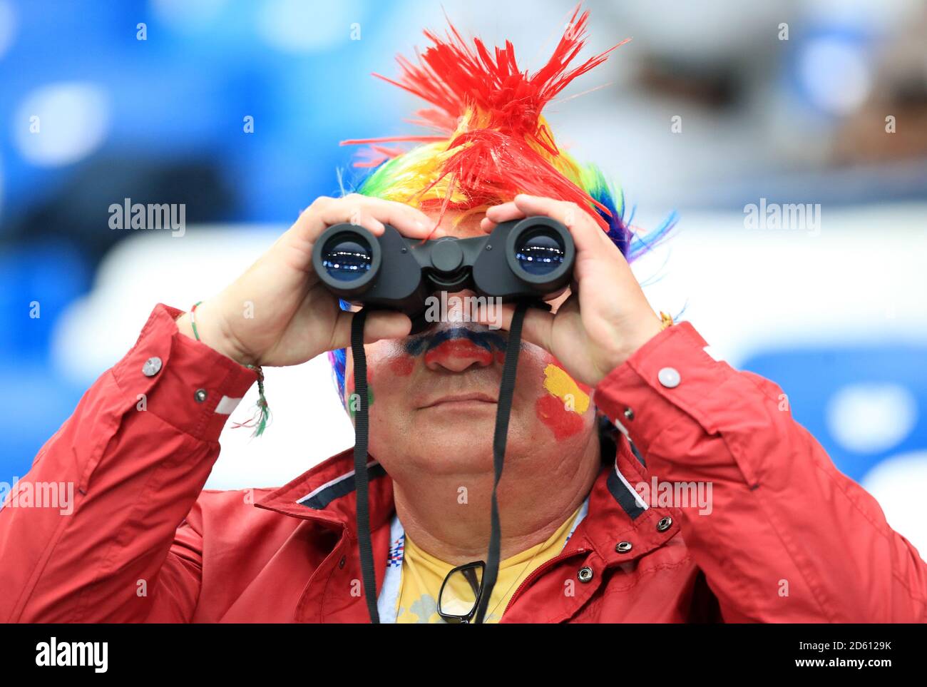 A fan in the stands looks through binoculars Stock Photo - Alamy