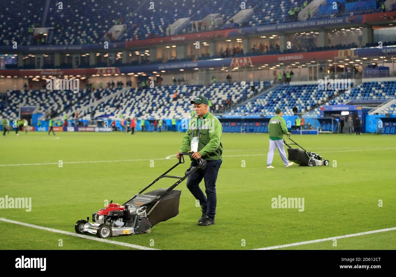 Groundsmen tend to the pitch with lawnmowers Stock Photo - Alamy