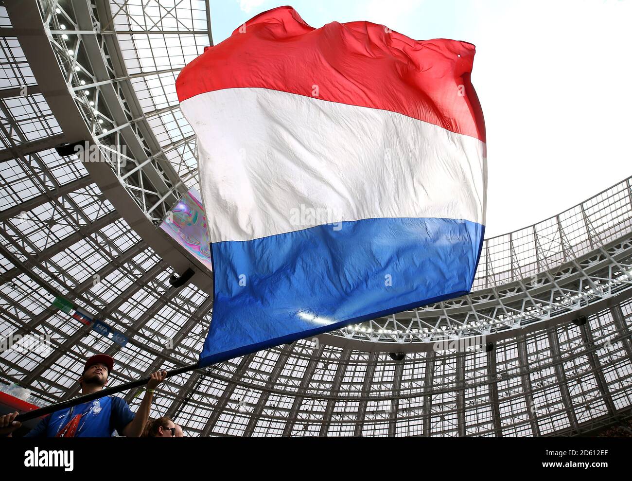 France fans wave flags in the build-up to the game Stock Photo - Alamy