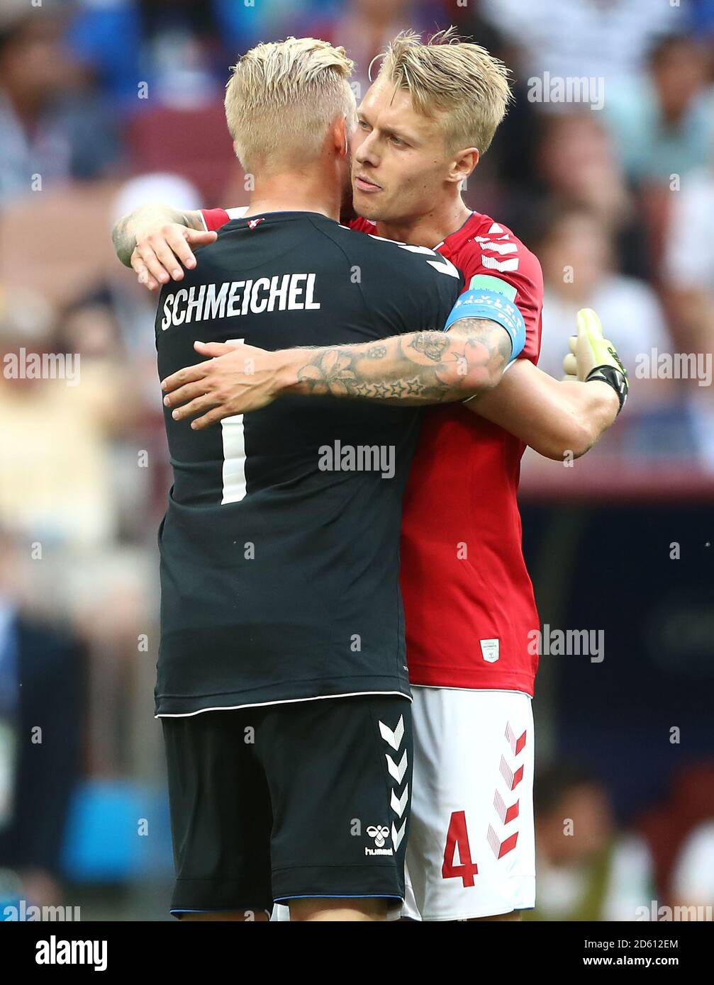 Denmark goalkeeper Kasper Schmeichel (left) and Simon Kjaer embrace ...