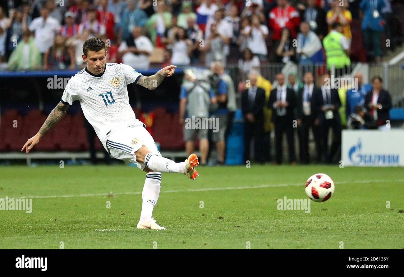 Russia's Fyodor Smolov scores his side's first penalty during the shoot ...