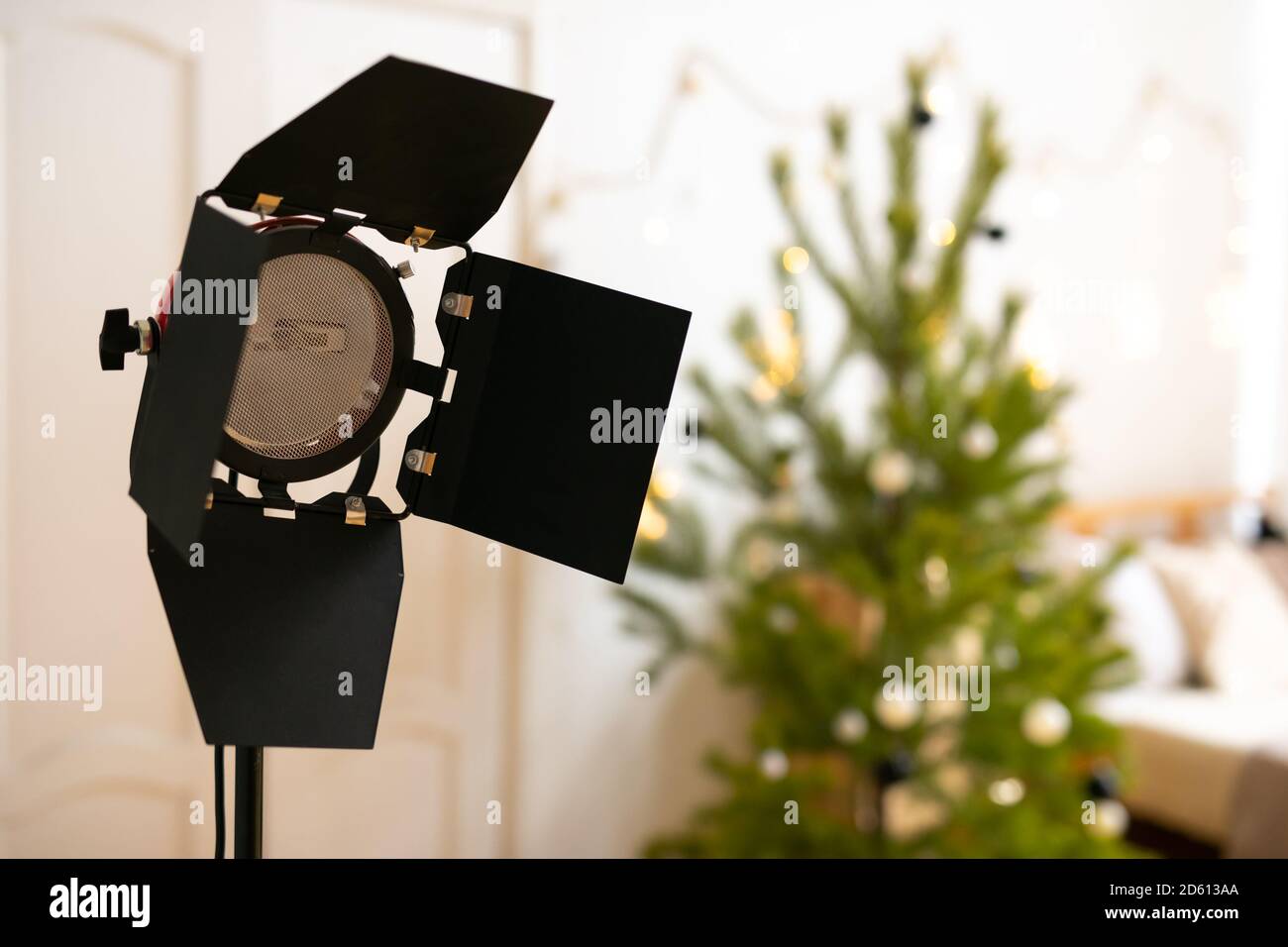Photography studio flash on a lighting stand on white background with ...