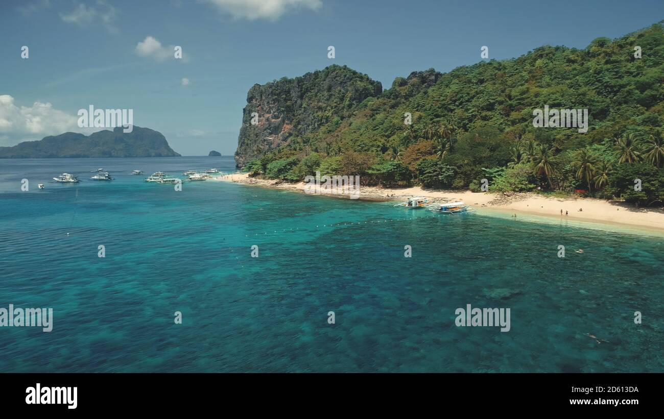 Ocean bay harbour with boats and passengers at sand beach aerial view ...