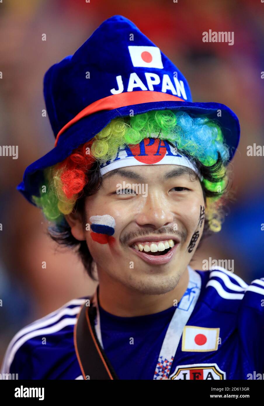 A japan fan shows his support in the stands hi-res stock photography ...