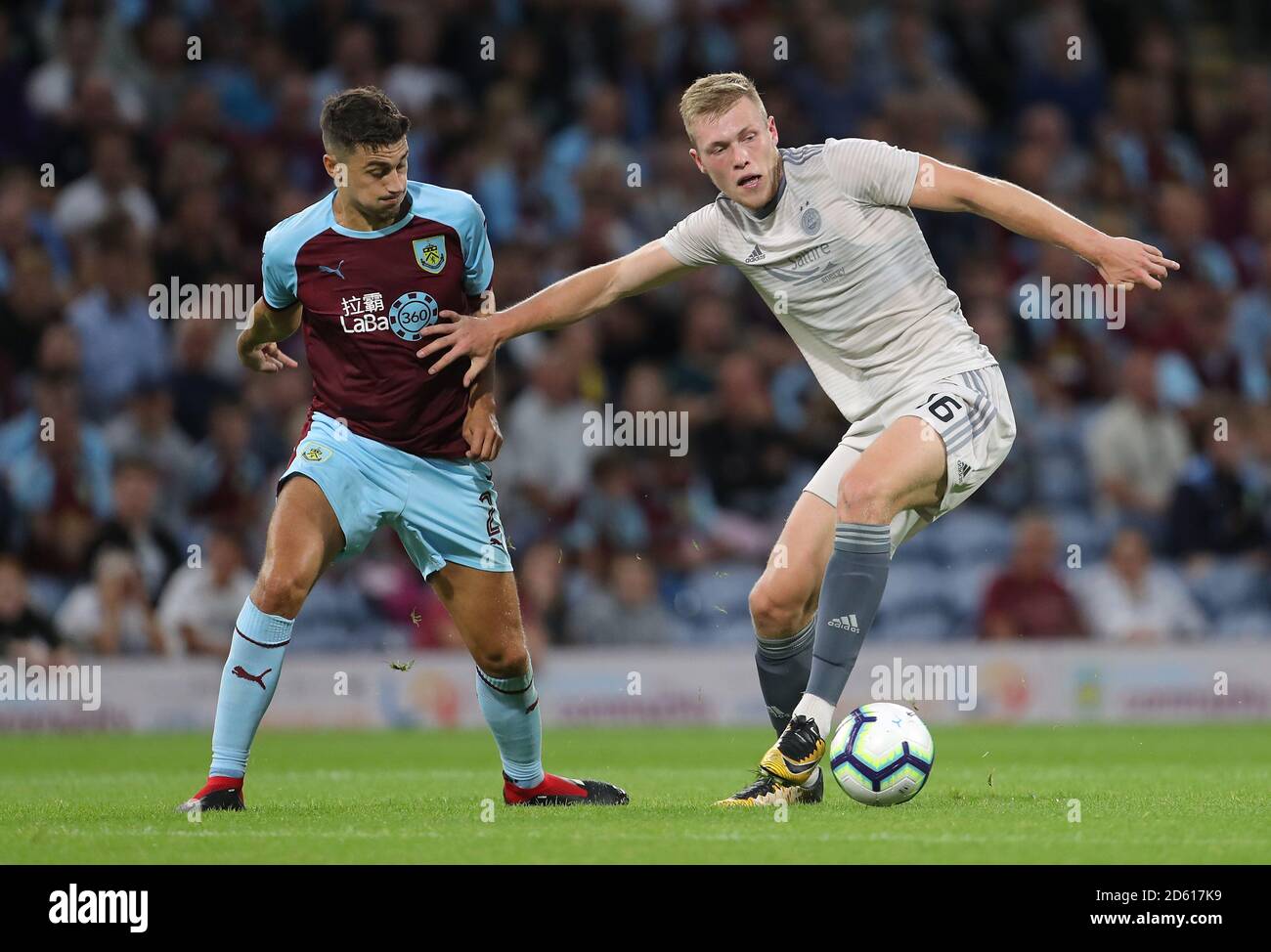 Burnley's Matthew Lowton (left) and Aberdeen's Sam Cosgrove battle for ...