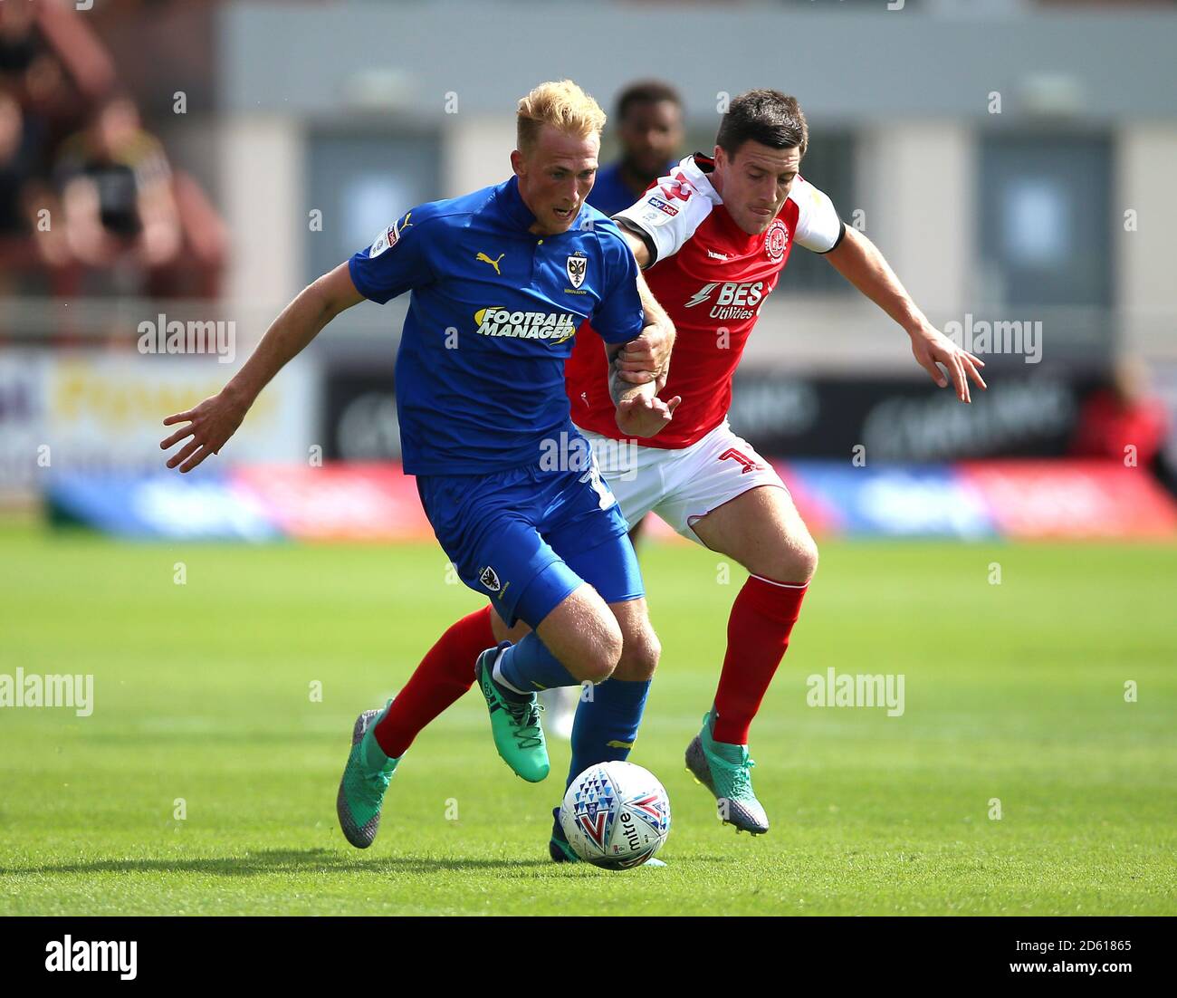 Fleetwood Town's Bobby Grant (right) and AFC Wimbledon's Michael ...