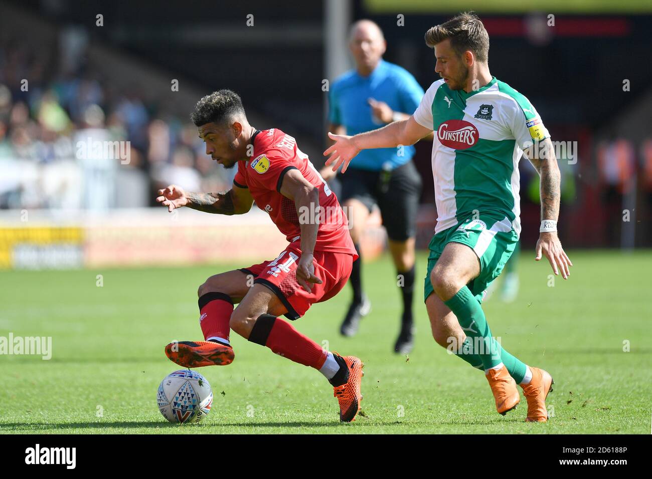 Walsall's Josh Ginnelly and Plymouth Argyle's Graham Carey compete for ...