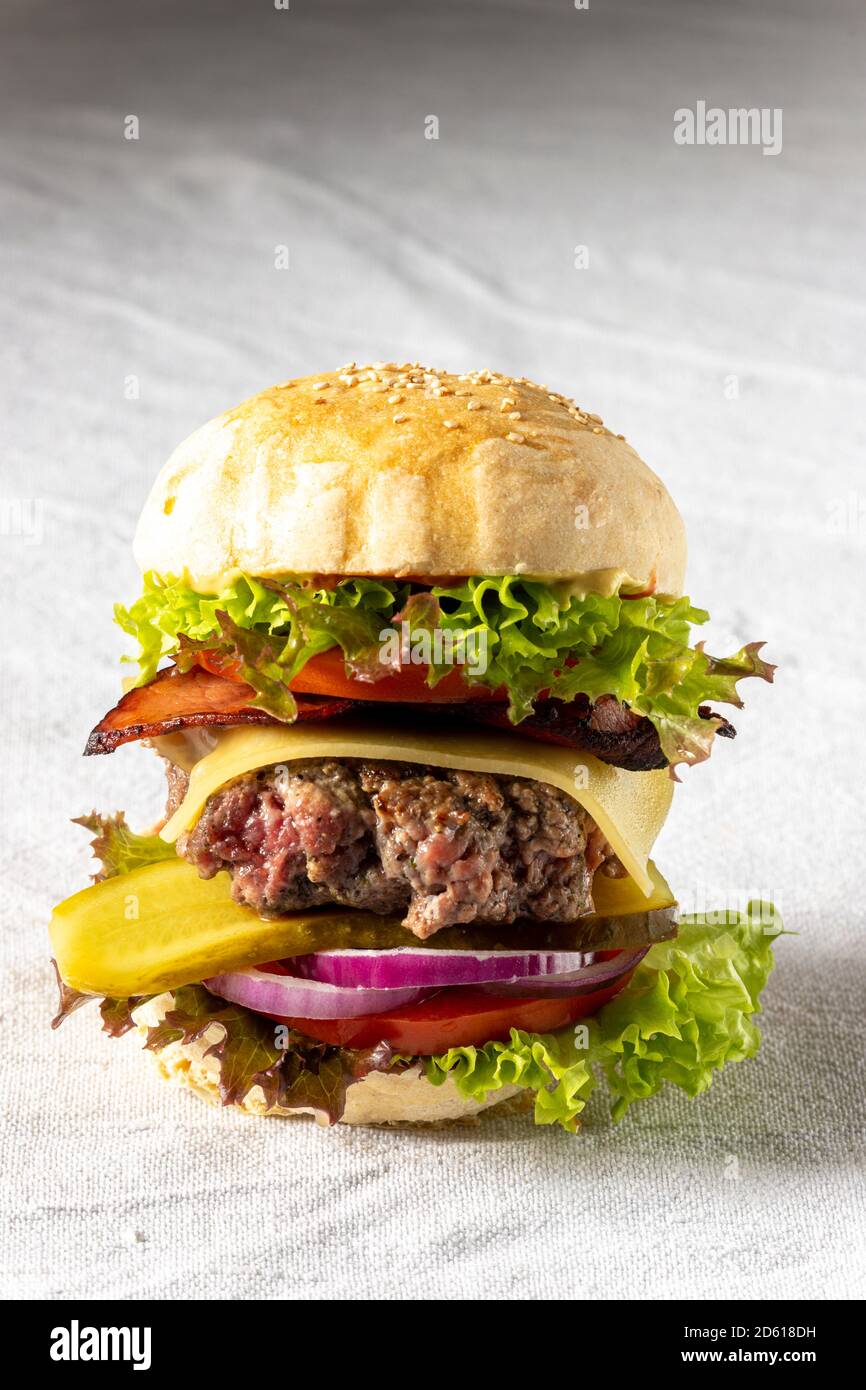 closeup of a single cheeseburger Stock Photo - Alamy