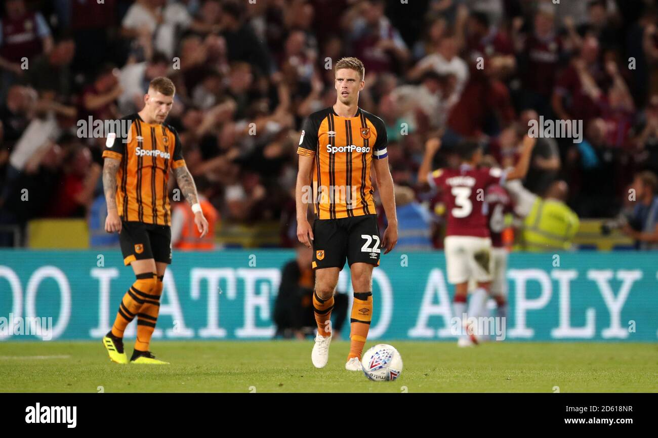 Hull City's Markus Henriksen (centre) appears dejected after Aston ...