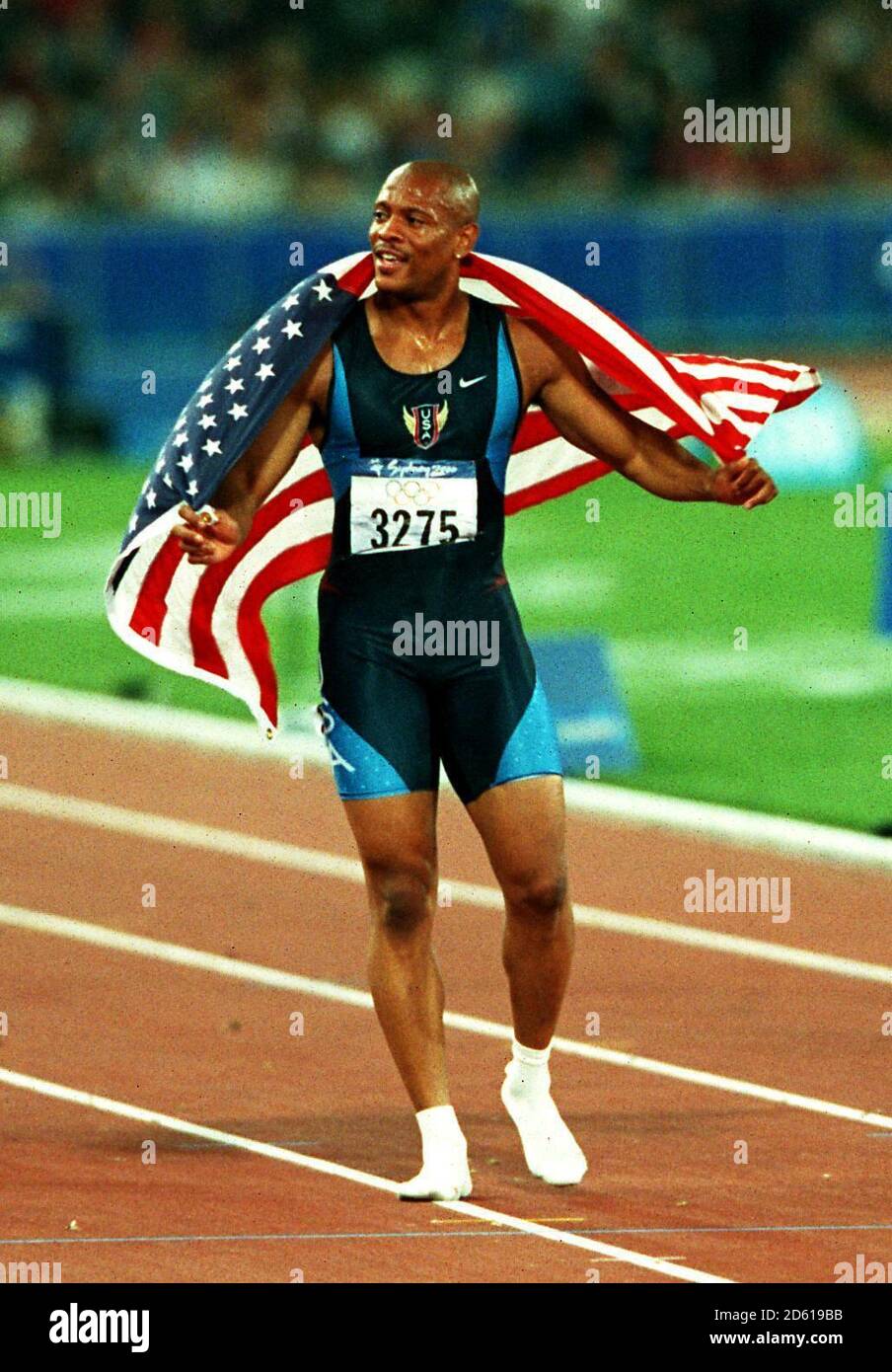The USA's Maurice Greene on his lap of honour - minus his shoes that he ...