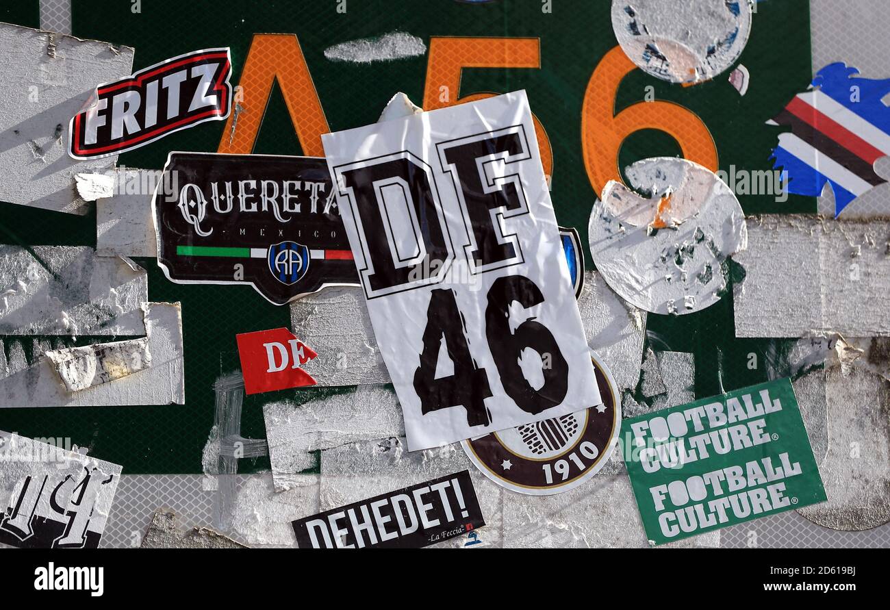 A collection of stickers on a road sign outside the ground Stock Photo ...