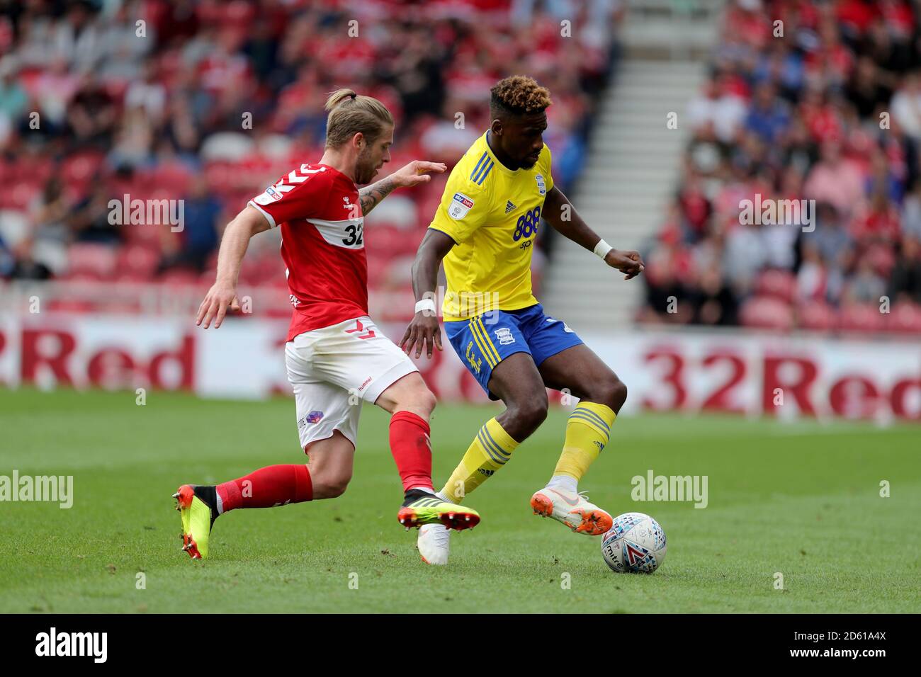 Birmingham City's Omar Bogle and Middlesbrough's Adam Clayton challenge ...