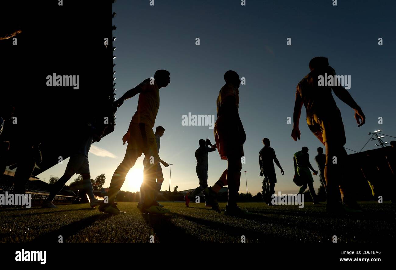 The two team's walk out before kick-off Stock Photo - Alamy