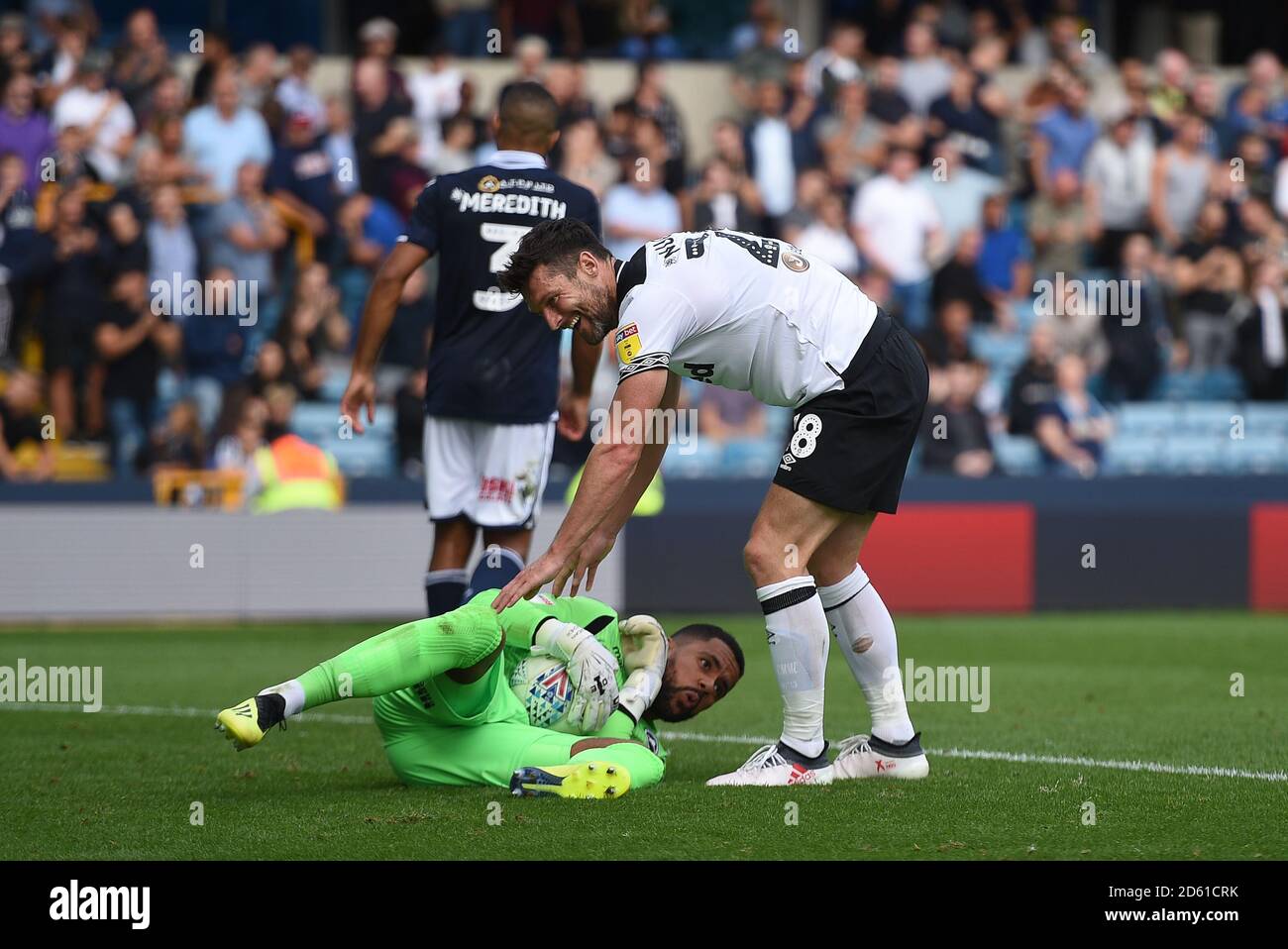 Derby County's David Nugent checks on Millwall goalkeeper Jordan Archer ...