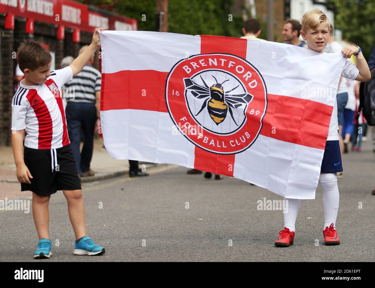 Brentford fans hold up a flag Stock Photo - Alamy