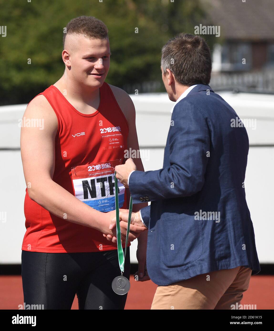 England North's Andrew Knight is presented with his silver medal in the ...