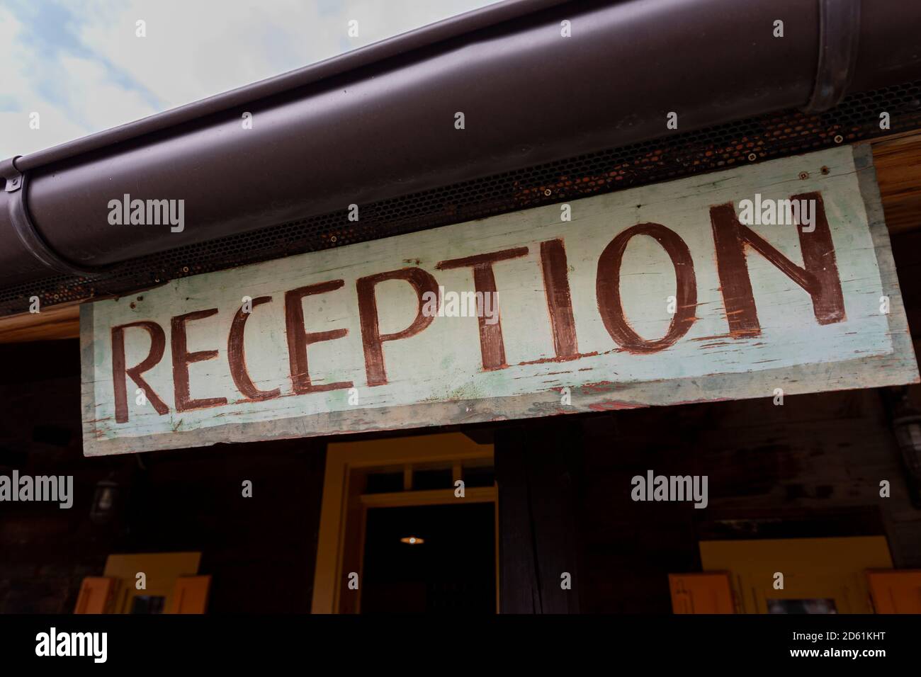 Reception sign made of wood at the Hotel entrance Stock Photo - Alamy