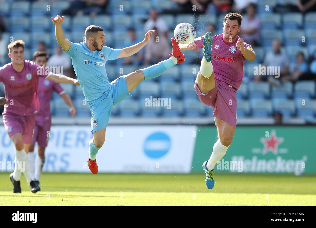 Coventry City's Conor Chaplin (left) and Rochdale's Harrison McGahey battle for the ball Stock ...