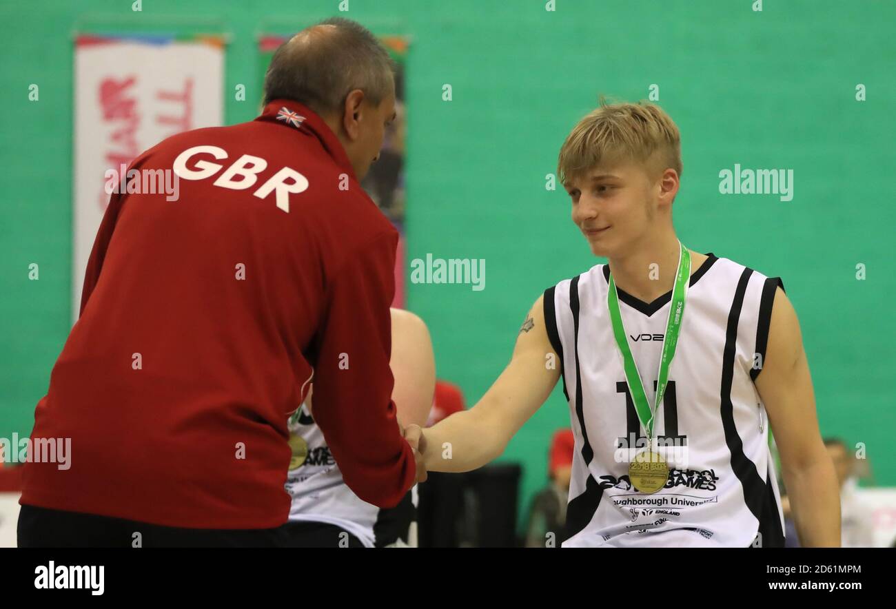 England North's Lee Fryer is presented with his gold medal during the ...