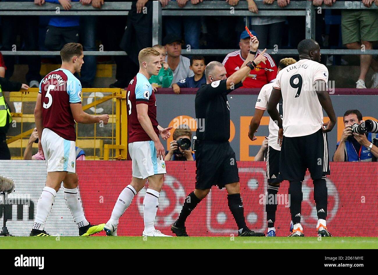 Manchester United's Marcus Rashford is shown a red card by match ...