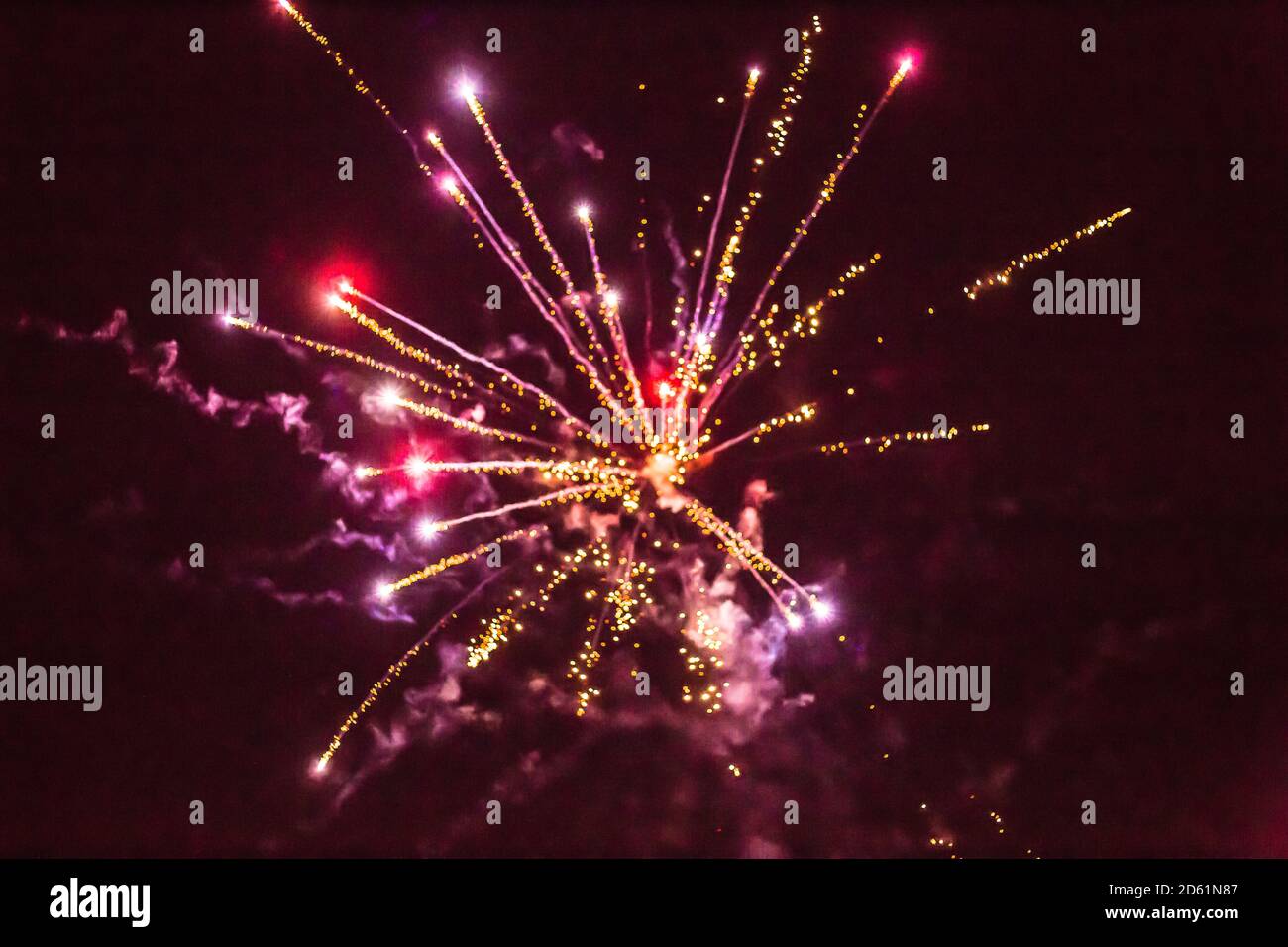 Purple and pink cosmic fireworks Stock Photo - Alamy