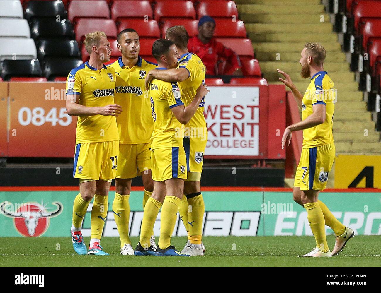 Wimbledon's Anthony Hartigan (centre) celebrates scoring his side's ...