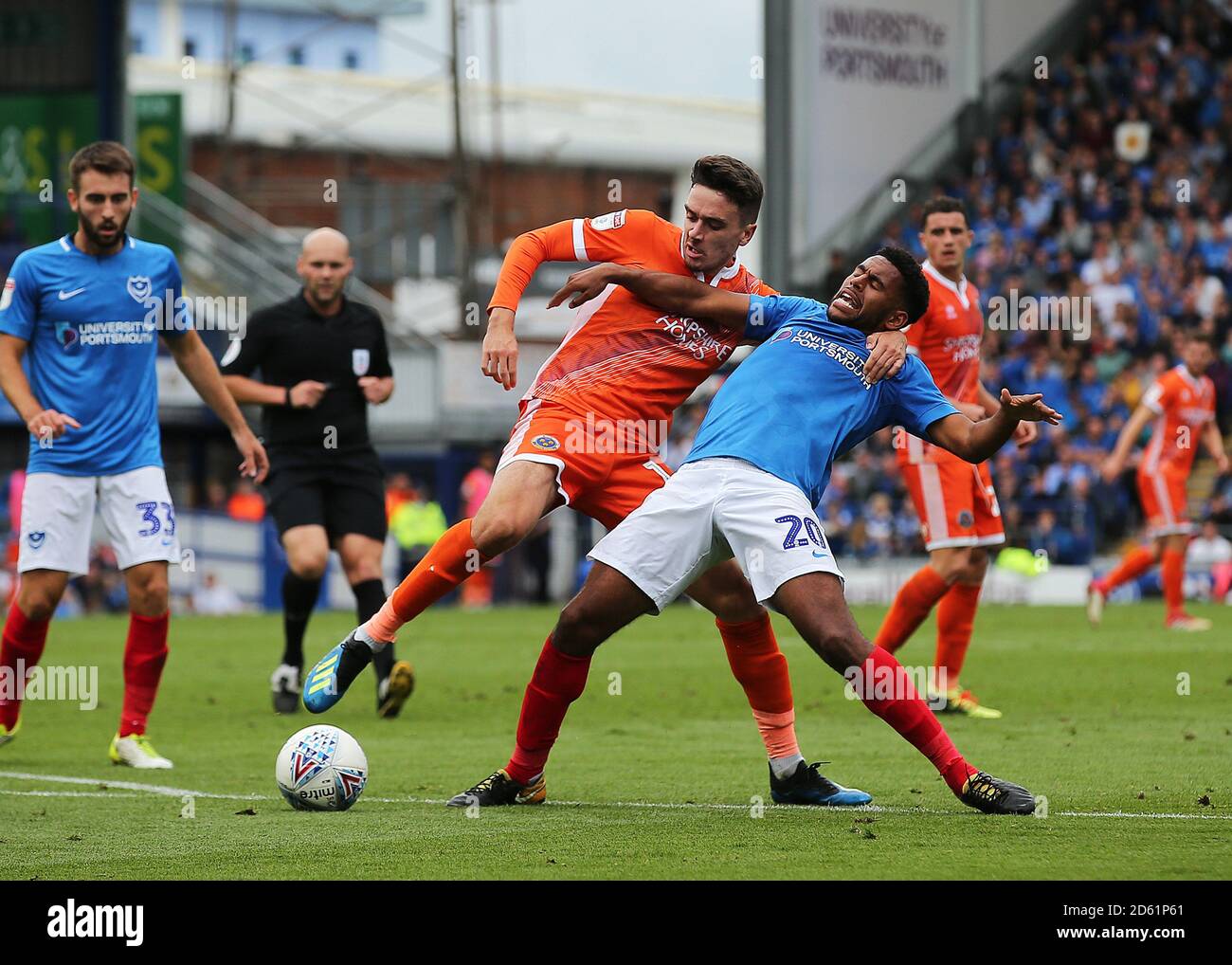 Shrewsbury Town's Alex Gilliead and Portsmouth's Nathan Thompson battle ...