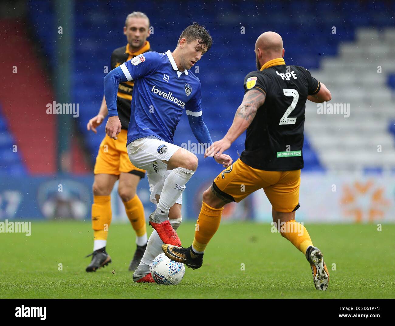 Oldham Athletic's Callum Lang and Newport County's David Pipe battle ...