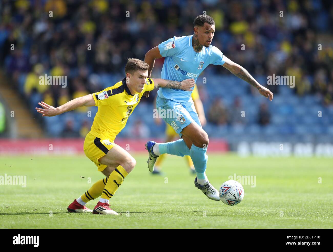 Coventry City's Jonson Clarke-Harris (right) and Oxford United's Josh ...